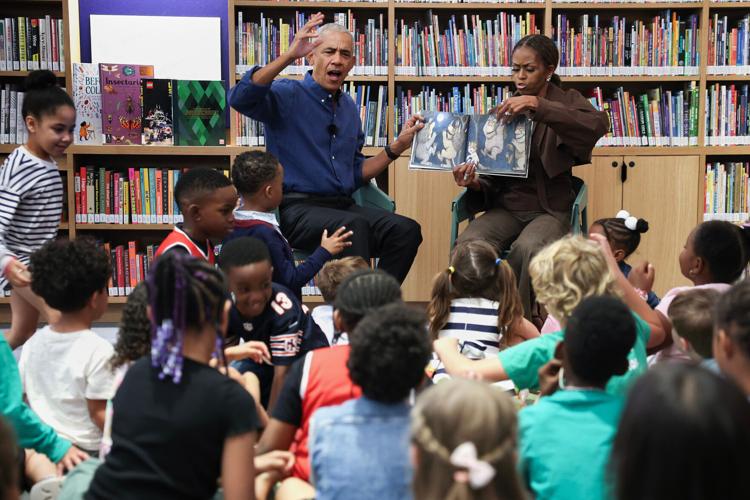 Barack and Michelle Obama surprise first visitors to newly opened ...