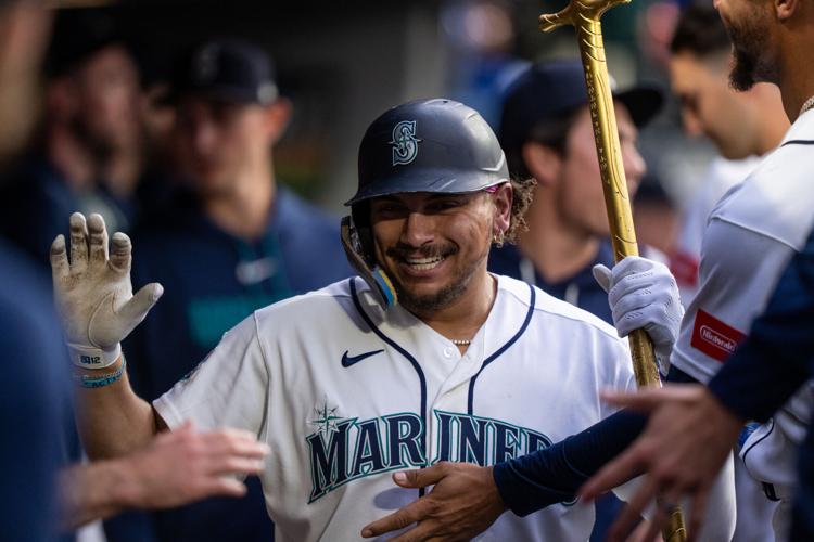 Mariners slugger Josh Naylor leaves game with back spasms after hitting ...