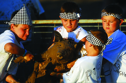 Pork and dreams: Hundreds turn out to vie for pig-wrestling glory