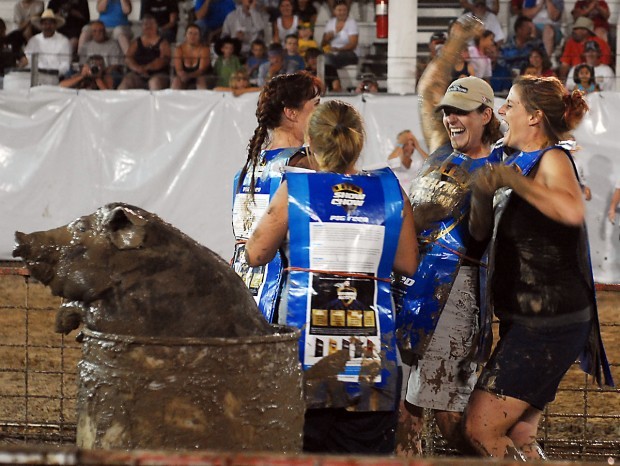 Pork and dreams: Hundreds turn out to vie for pig-wrestling glory