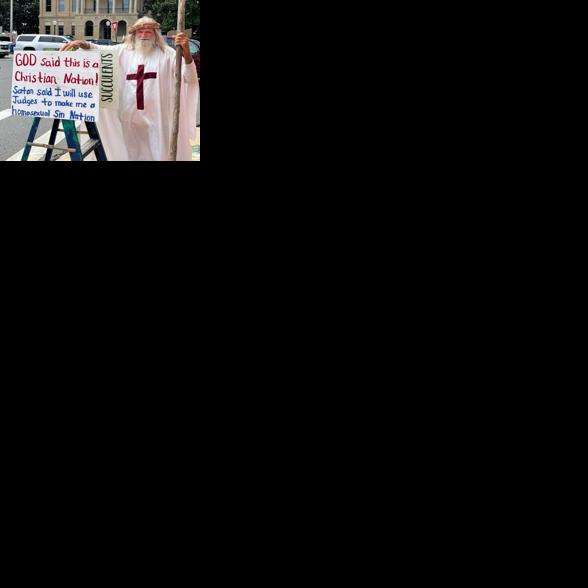 Visitor in white robe preaching against "homosexual sin" | Local News ...