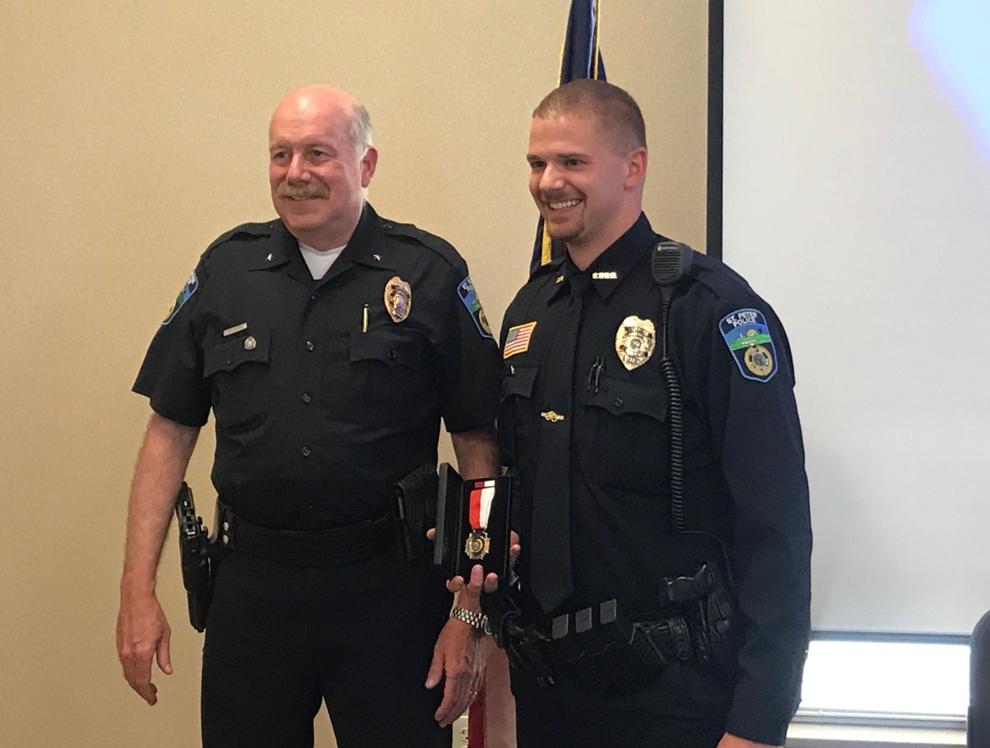 Officer who saved three from burning building awarded for service ...