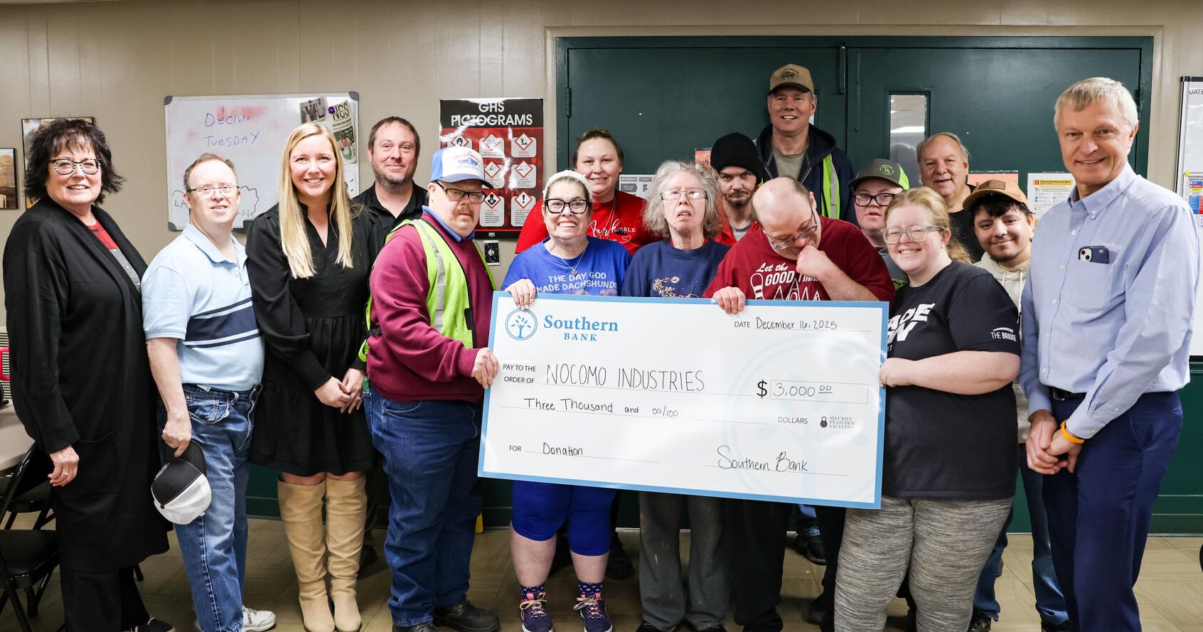 Southern Bank helps NOCOMO with door project | Multimedia | Maryville Forum