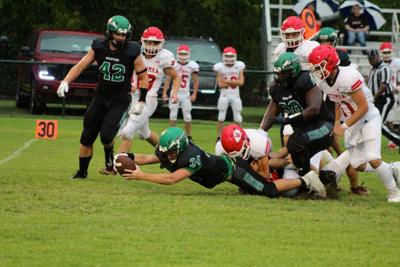 HS FOOTBALL: Quinton battles in rain-soaked season opener | Sports ...