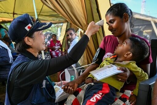 Anguished Sri Lankans queue for care after deadly cyclone | National ...