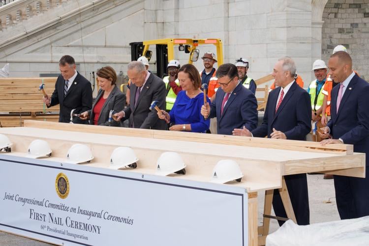 Construction on 2025 presidential inaugural platform with ceremonial driving of the first nail ...