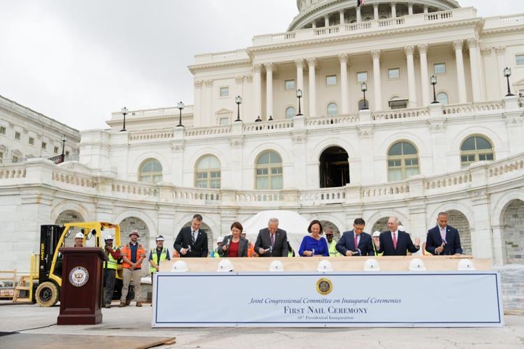 Construction on 2025 presidential inaugural platform with ceremonial driving of the first nail ...
