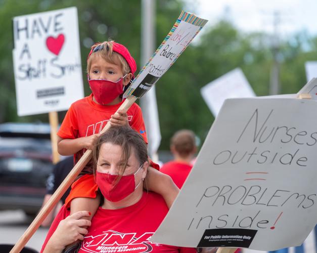 Nurses picket during off-work hours outside hospital | Local ...