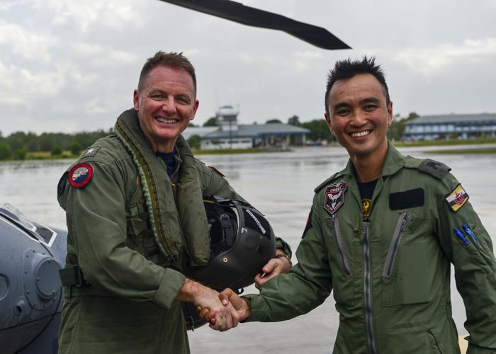 A first: U.S. Navy Admiral pilots Brunei Black Hawk helicopter at CARAT ...
