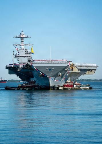 The world’s largest aircraft carrier and strike group return from ...