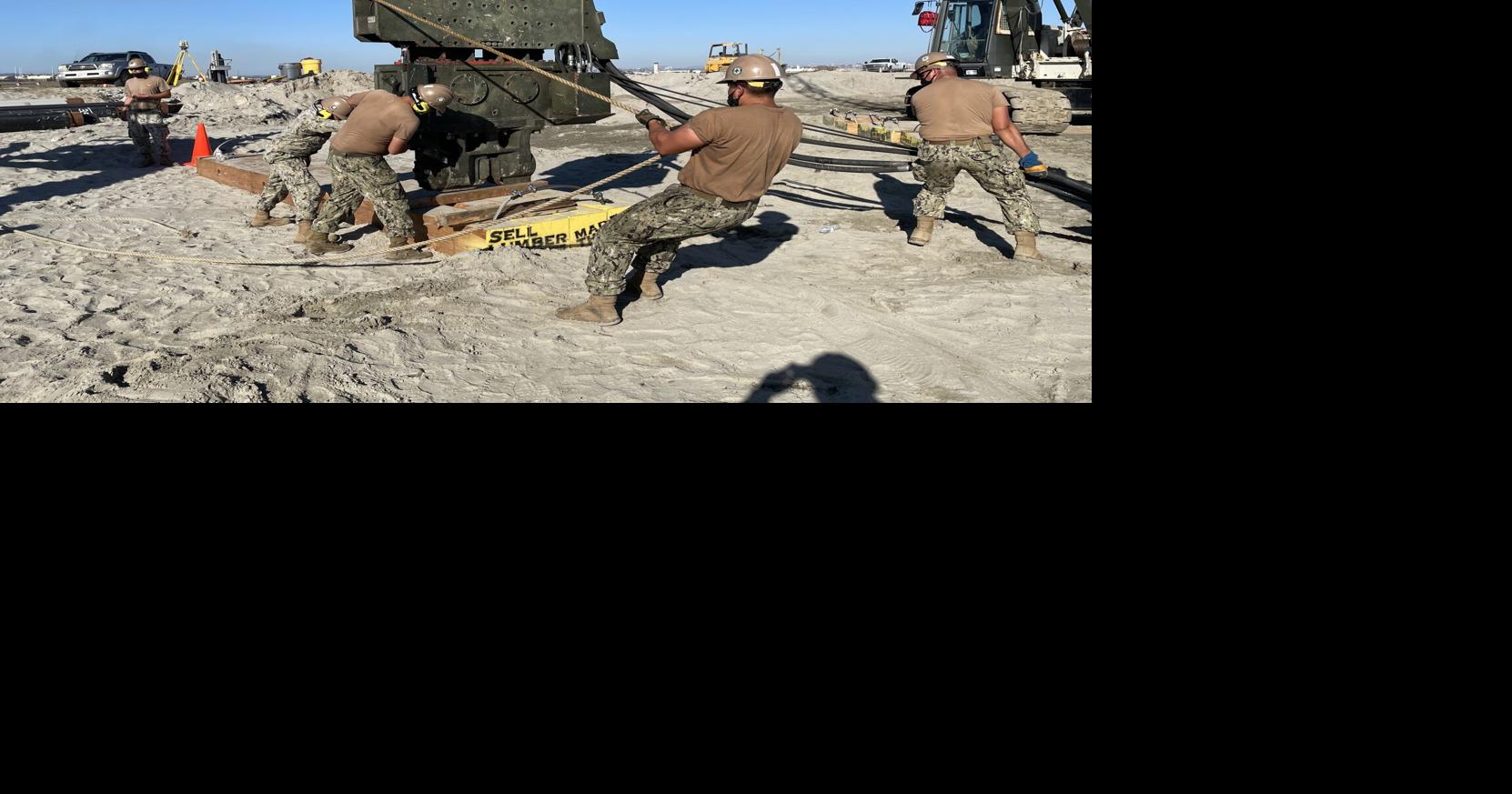 Naval Mobile Construction Battalion FOUR constructs pier system with ...