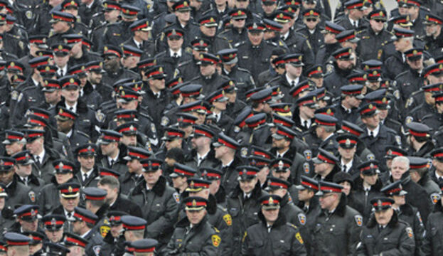 Thousands attend fallen police officer's funeral