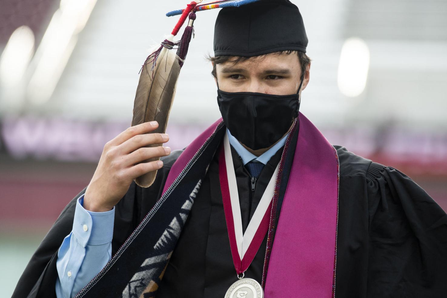 Graduates don caps, gowns and masks at UM commencement