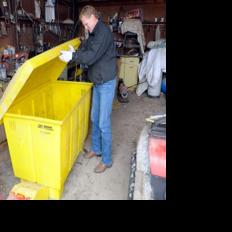Jack Stivers opens a calf warming box