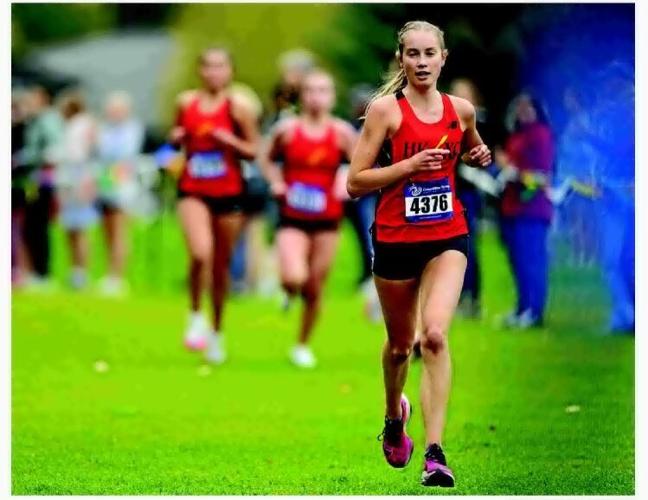 WILTSE, NEWMAN RUN TO TITLES