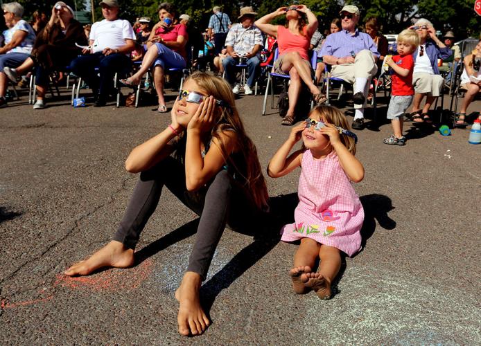 Hundreds gather in for solar eclipse block party in front of Polson Library