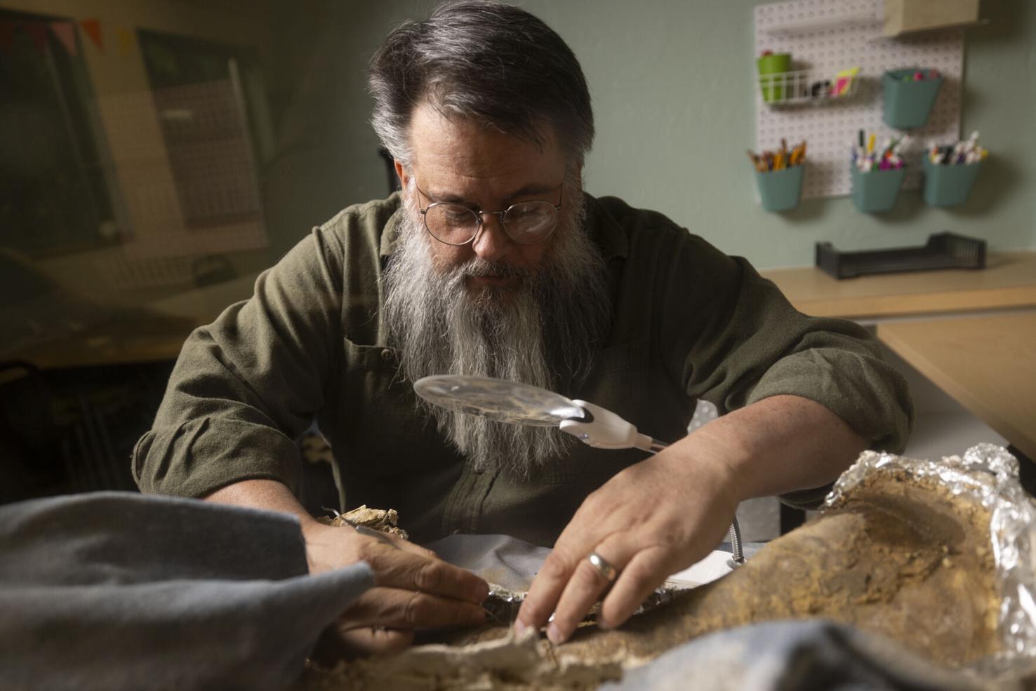 Paleontologist shows public dinosaur fossil work in Missoula