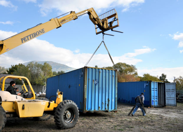 Shipping containers converted to drive-through coffee stand