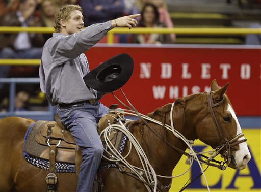 Tuf Cooper takes tie-down roping lead