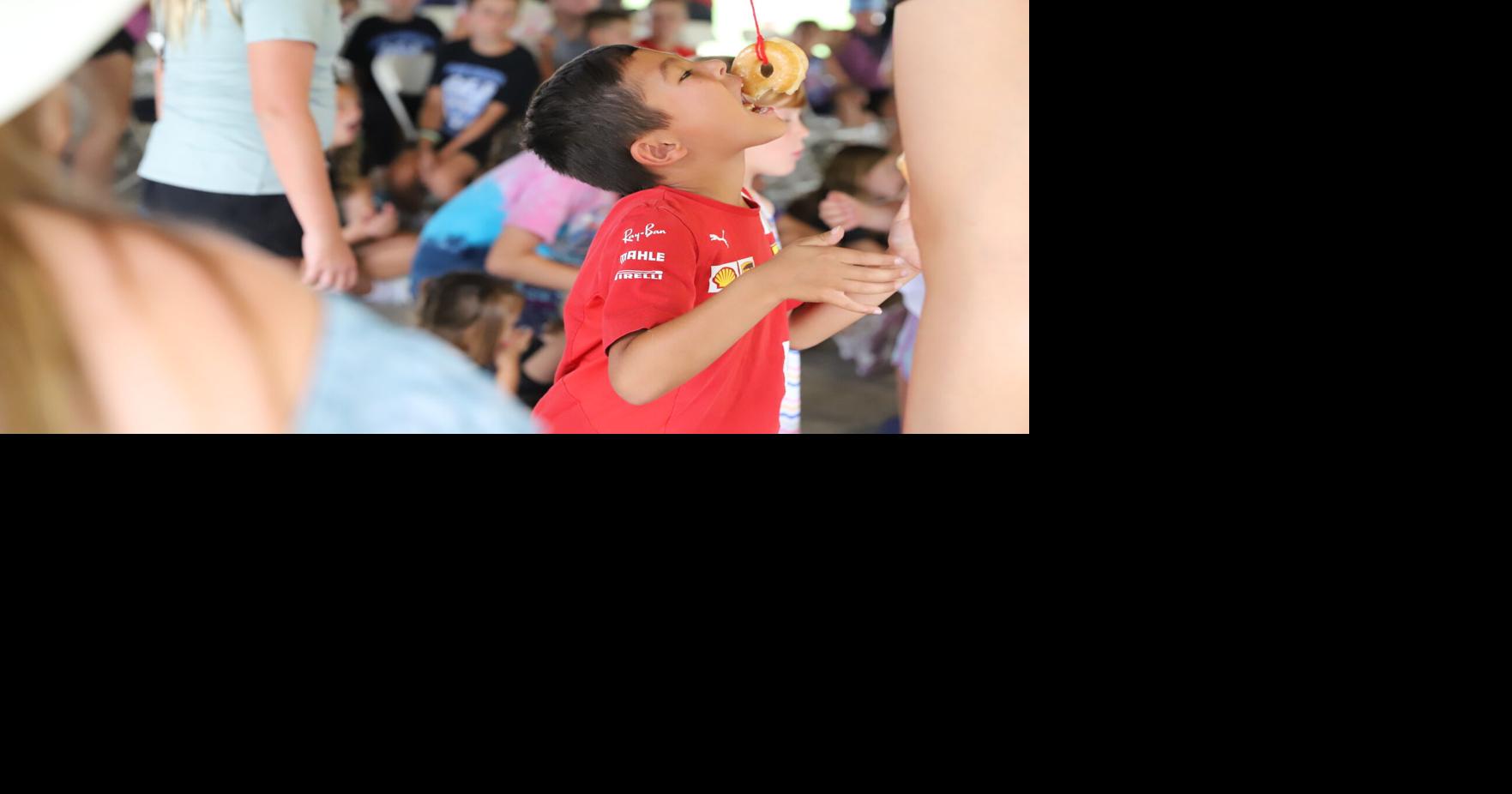 PHOTO GALLERY: Donut on a String Eating Contest | Gallery | missourian.com