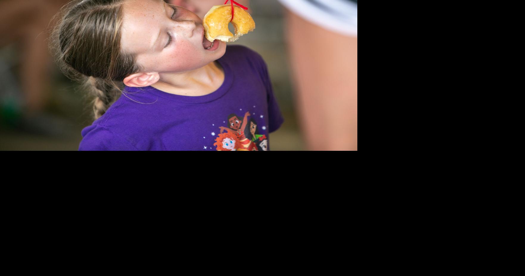 PHOTO GALLERY: Battle of the Bites at the Donut on a String Contest ...