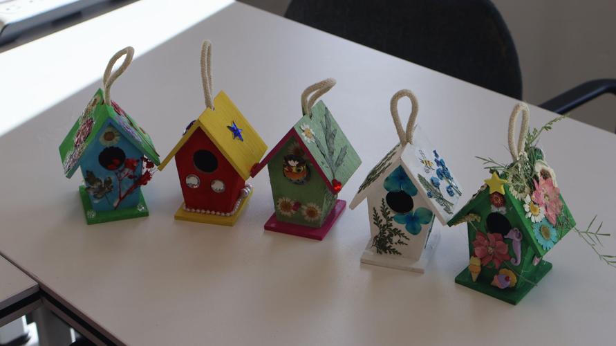 Photos: Seniors turn plain birdhouses into floral works of art | News ...