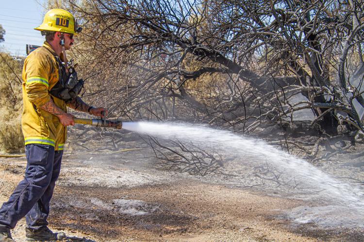 Visual story: Fire suppression continues in blaze that spread from ...