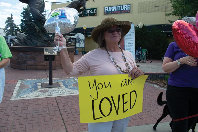 Group rallies downtown to spread love and positivity | Local News ...