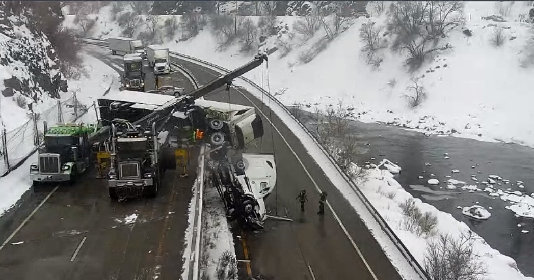 Truck crashes through guardrail, onto road below, closing I-70 | News ...