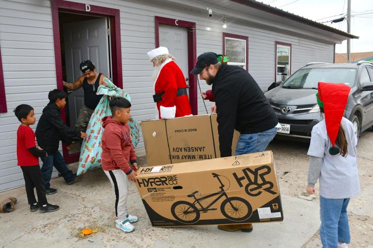 Santa, VFW members deliver Christmas joy to local children facing a ...