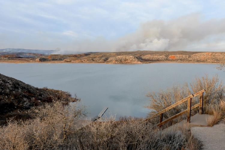 Firefighters from multiple agencies battle large wildfire near Lake ...