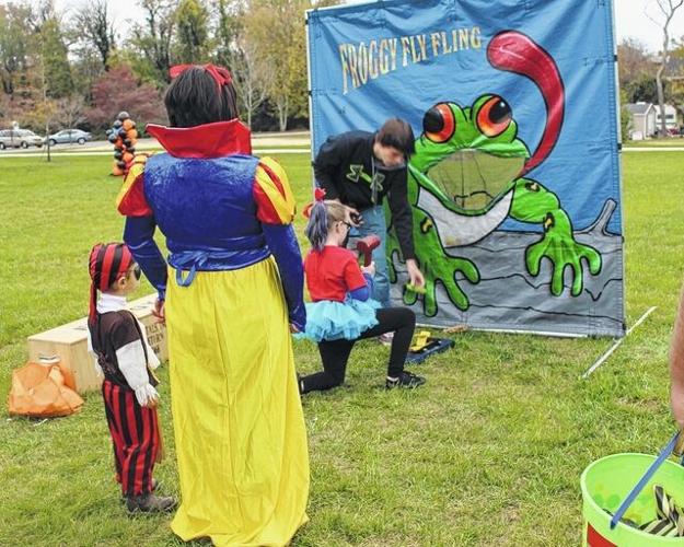Trick-or-treaters abound in Dobson Square Park during Halloween ...