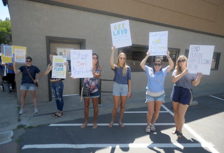 Demonstrators rise up against human trafficking on courthouse steps ...