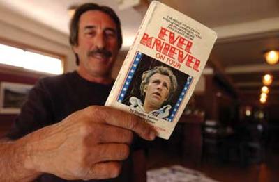Evel's fall from grace Butte native Joe Little holds the copy of ...