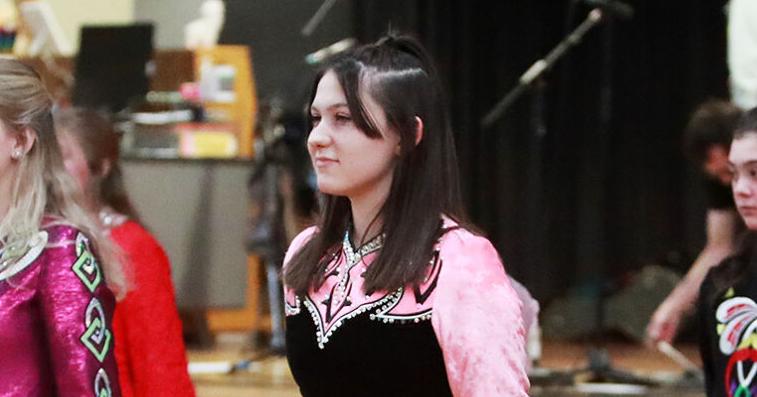 Dancing with her ancestors in her solo Irish dance dress