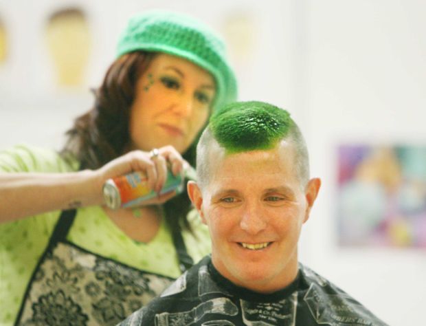 Principal loses bet, gets green Mohawk