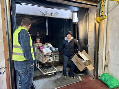 Volunteers step up to help Thompson Family Food Drive