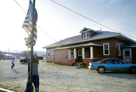 Raising the flag Sixth-grader Caleb Salusso hoists the flag at the ...