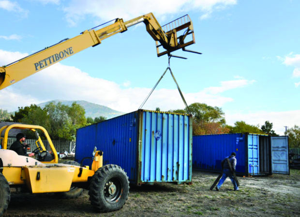 Shipping containers converted to drive-through coffee stand