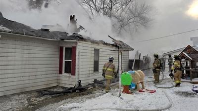 Firefighters battle house fire, cold