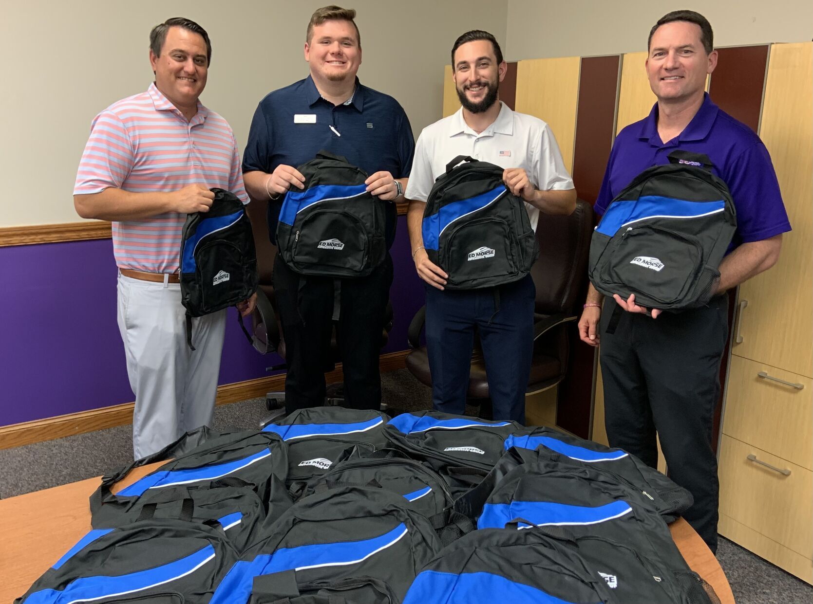 Ed Morse and team donates 100 backpacks to Muscatine students in-need