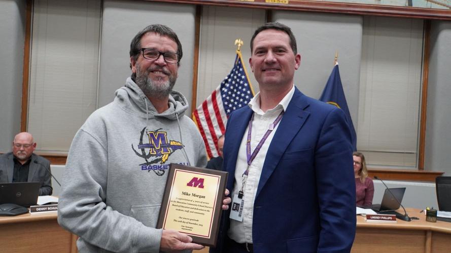 School board honors Mike Morgan, re-elects John Dabeet as board president