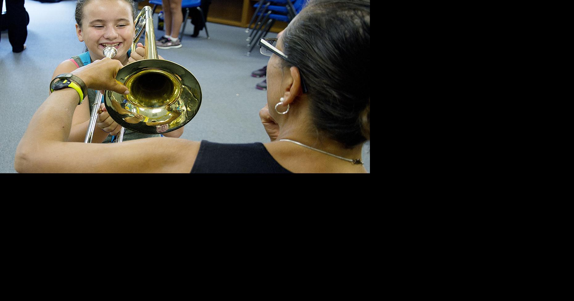 Try the tuba: Elementary students try out different instruments