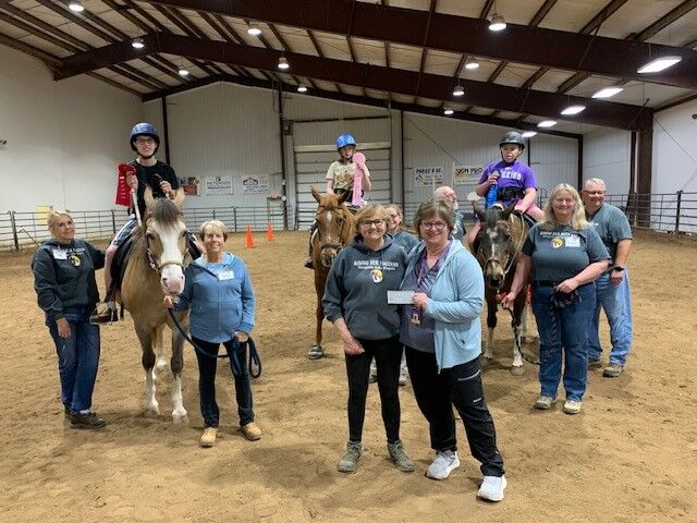 Pilot International presents $1,200 check to Riding for Success