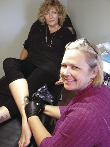 Paw print tattoos for the OSPCA during July