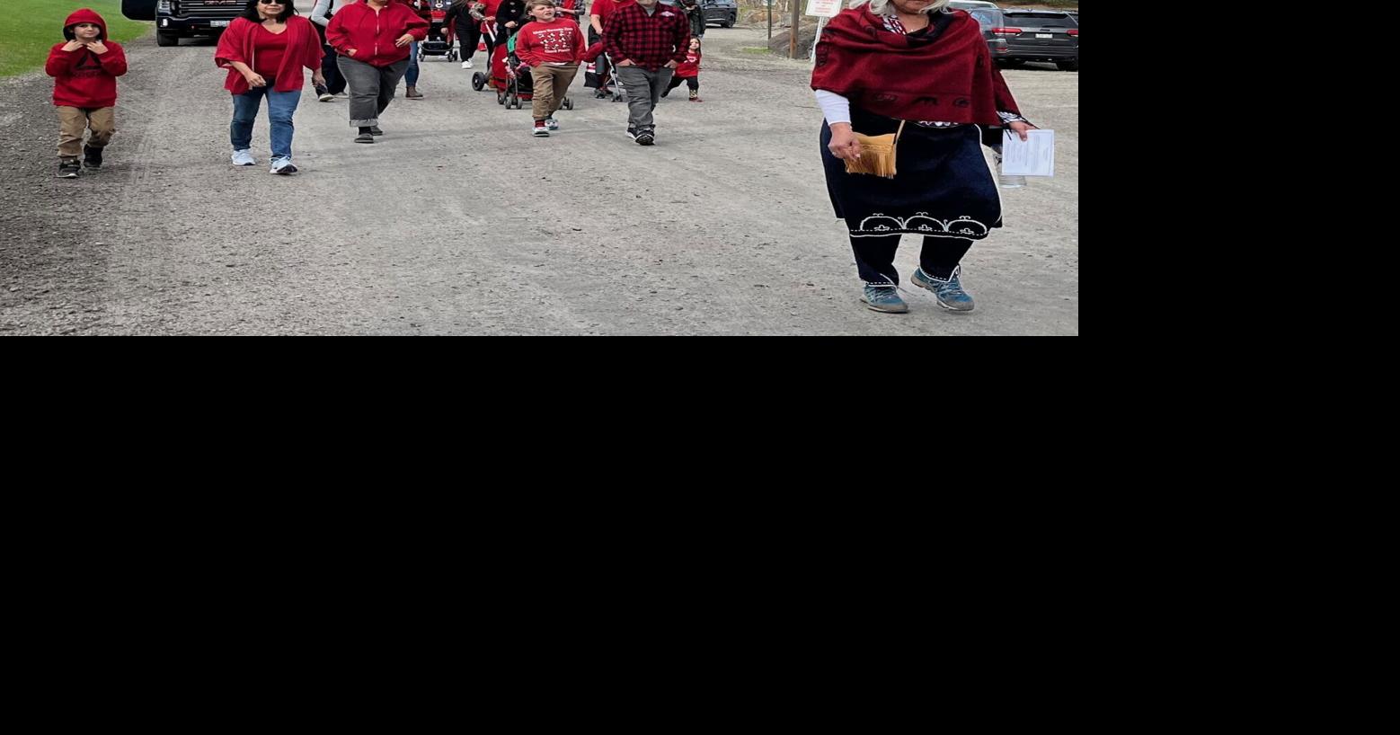 Wahta Mohawk members march in solidarity on Red Dress Day