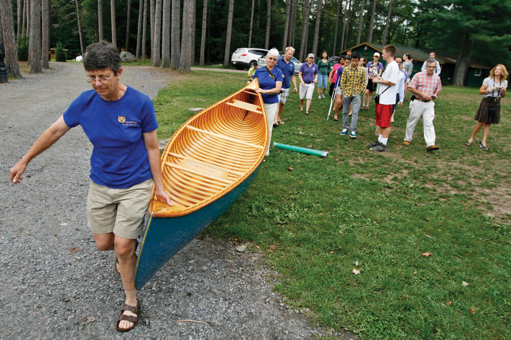 G8 spouses give new canoe to Camp Ooch