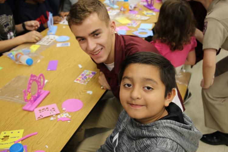 Corps cadets stand in at 'Memories with Mom' at Navarro Elementary ...