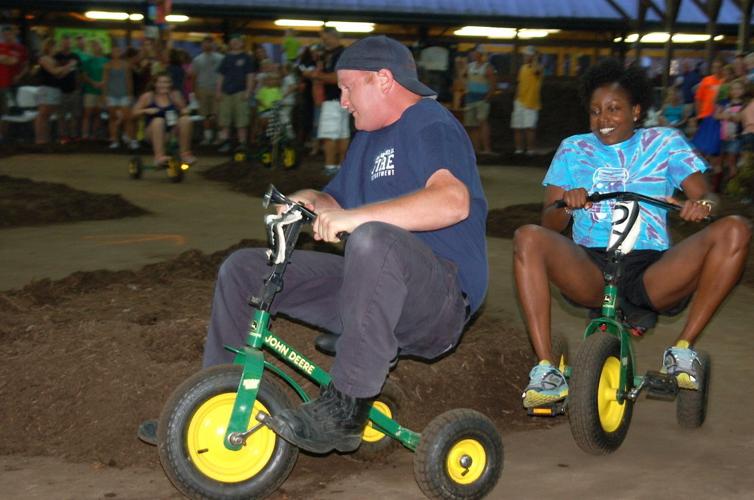 Adults compete in Tricycle Races at QA Fair | News | myeasternshoremd.com