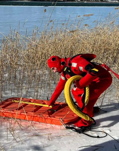 Firefighter crawls 350 feet across ice to rescue stranded hunter | News ...